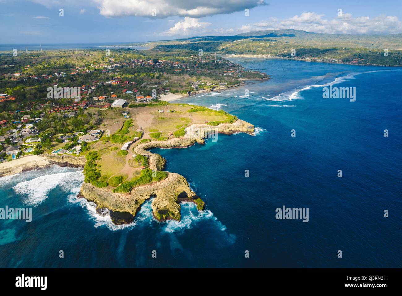 Aerial view of Devil's Tear and the rocky coastline of Nusa Lembongan ...