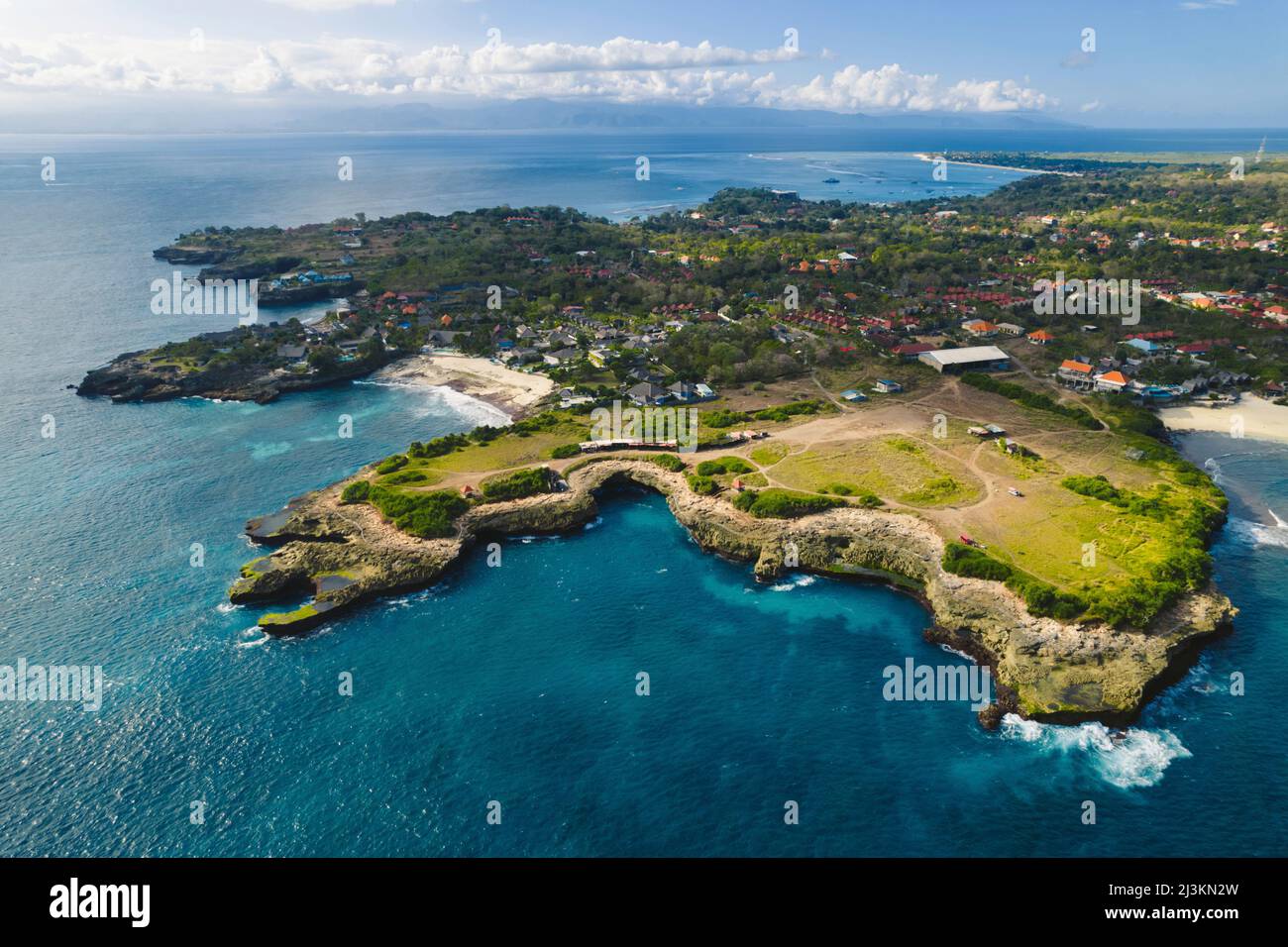 Aerial view of Devil's Tear and the rocky coastline of Nusa Lembongan ...