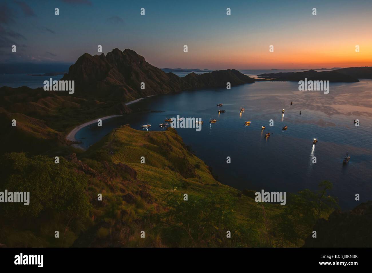 Boats moored in the bay at Padar Island in Komodo National Park in the ...