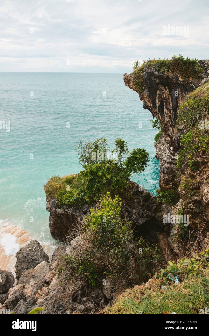 Cliffs and rock formations on the beach along the Bukit Peninsula at ...