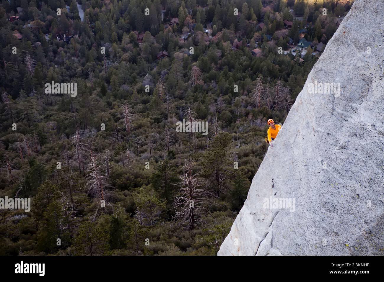A man climbs above the scary and difficult route 'The Edge' on Tahquitz ...