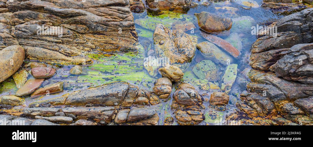 Natural beauty of a clear water stream sitting over a natural rock ...