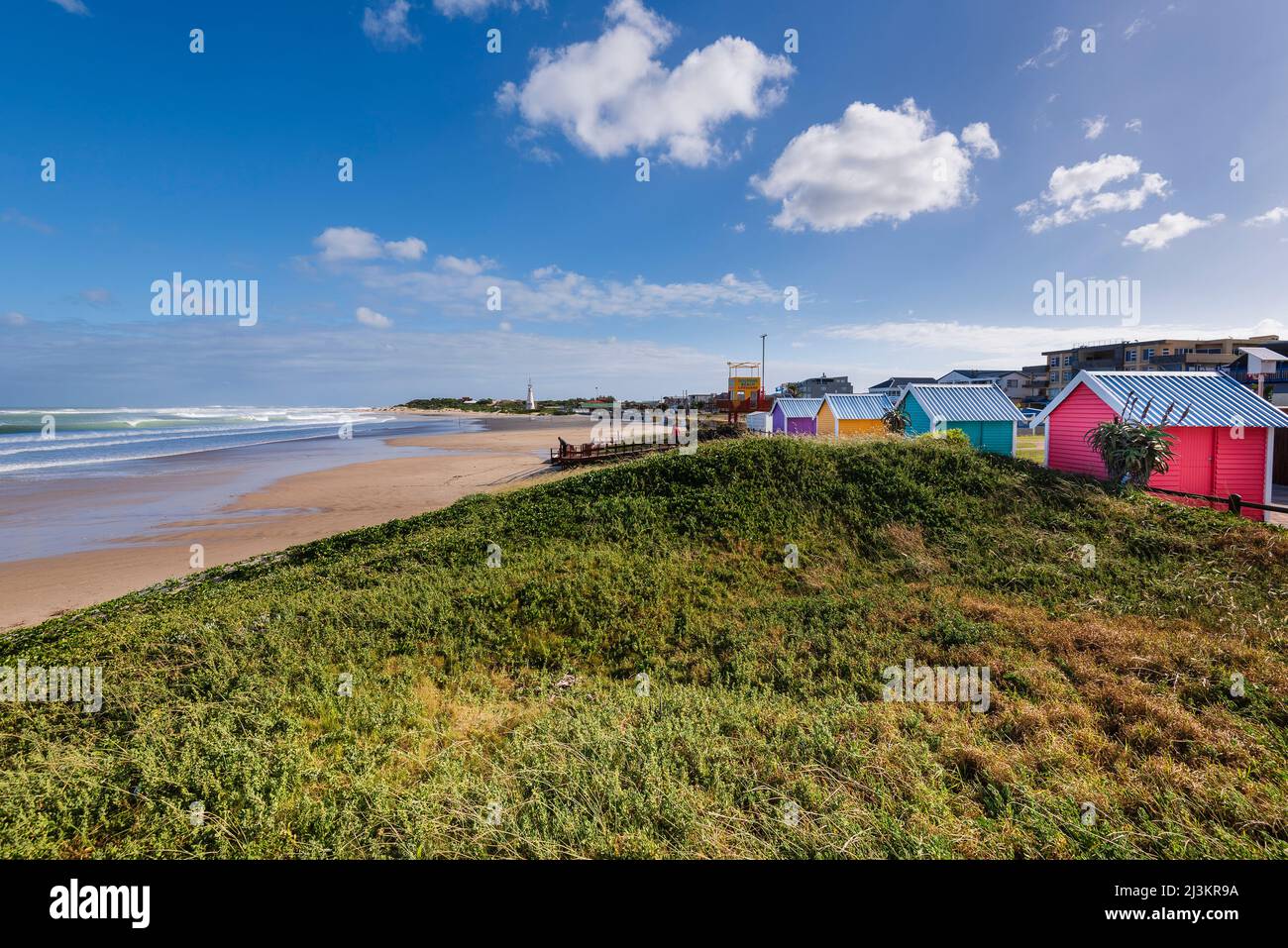 Colourful changing houses and lifeguarding station on Dolphin Beach at ...
