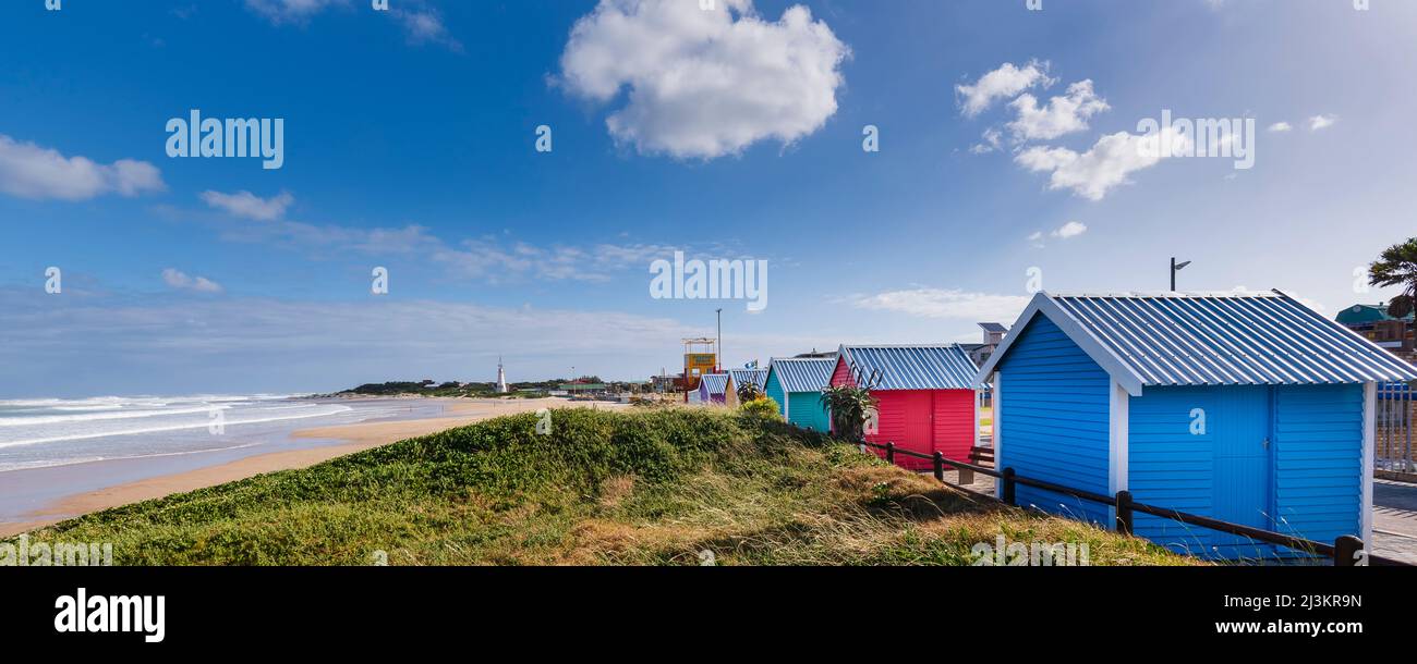 Colourful changing houses and lifeguarding station on Dolphin Beach at ...