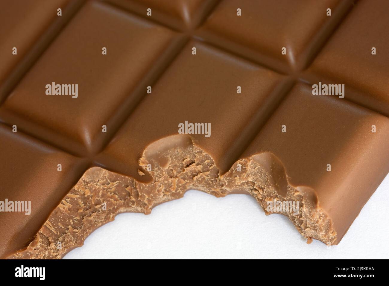 Bitten off chocolate bar Stock Photo - Alamy
