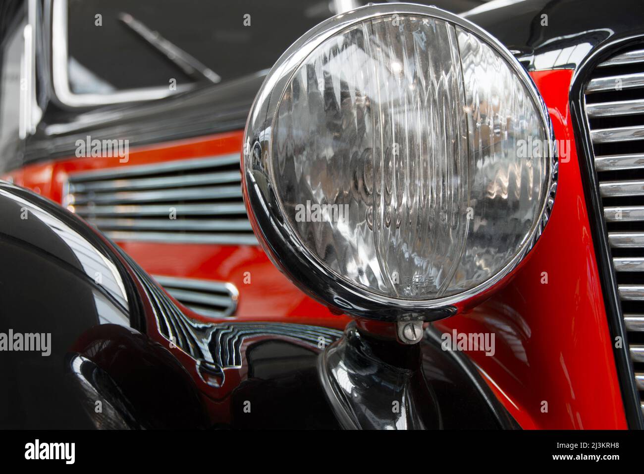 Close-up/detail image of restored classic cars with red and black ...