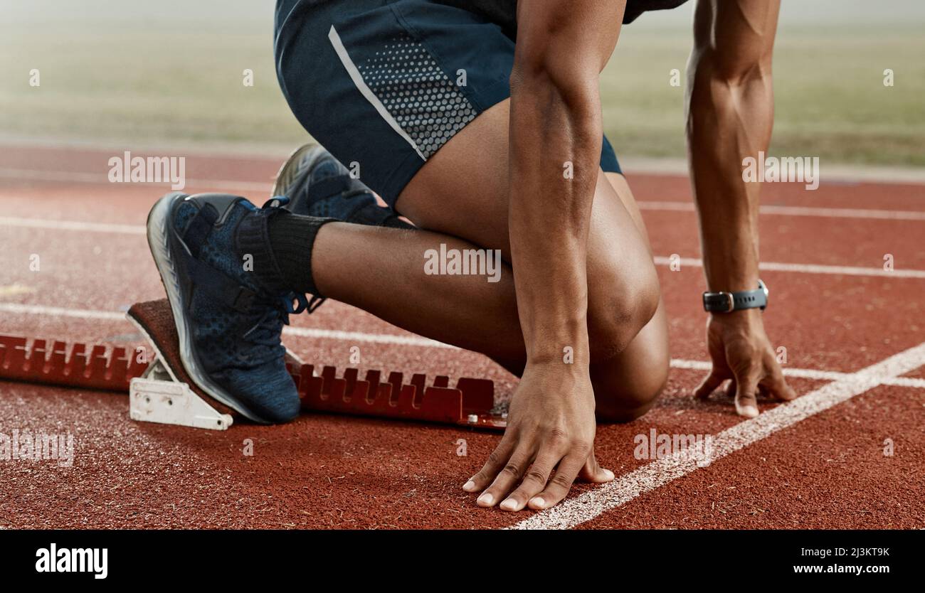 Time to turn into the flash. Shot of a male athlete waiting at the ...