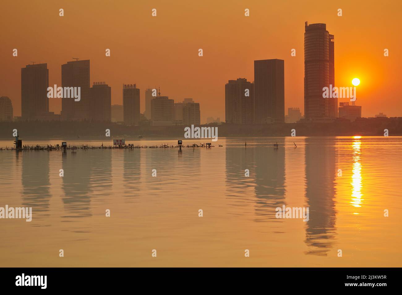 Nanjing skyline seen across Xuanwu Lake at sunset, Jiangsu province ...