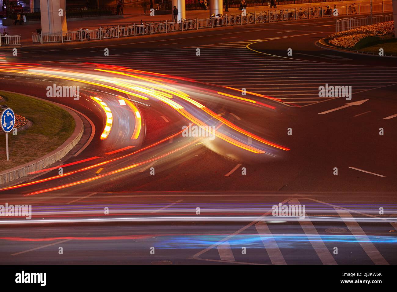 Evening traffic on a roundabout in the Luzjiazui district of Pudong ...