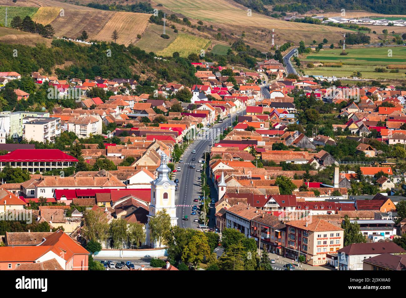 Aerial view of the town center with hills, buildings, streets ...