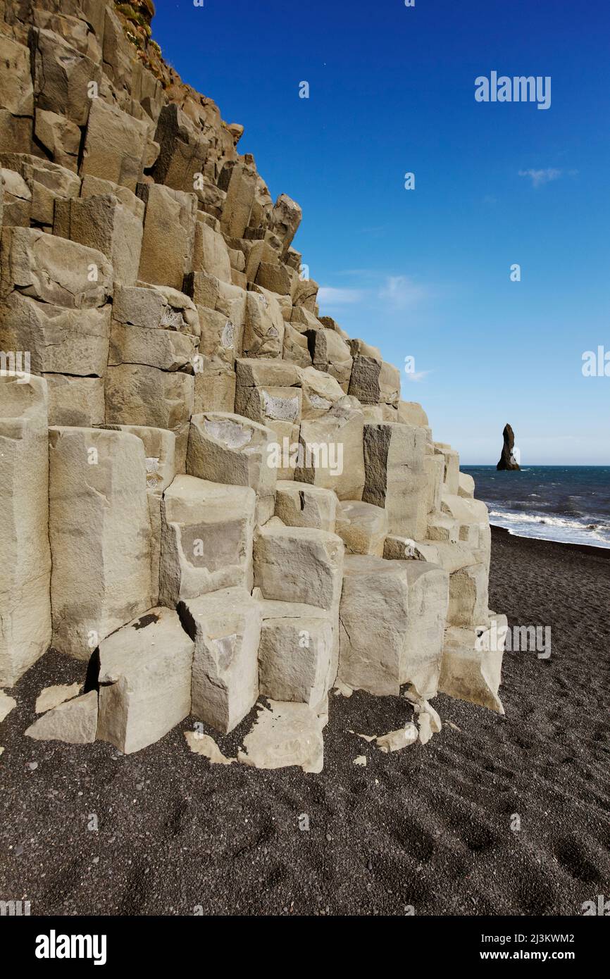 Volcanic basalt cliffs and black beach, on the south coast of Iceland ...