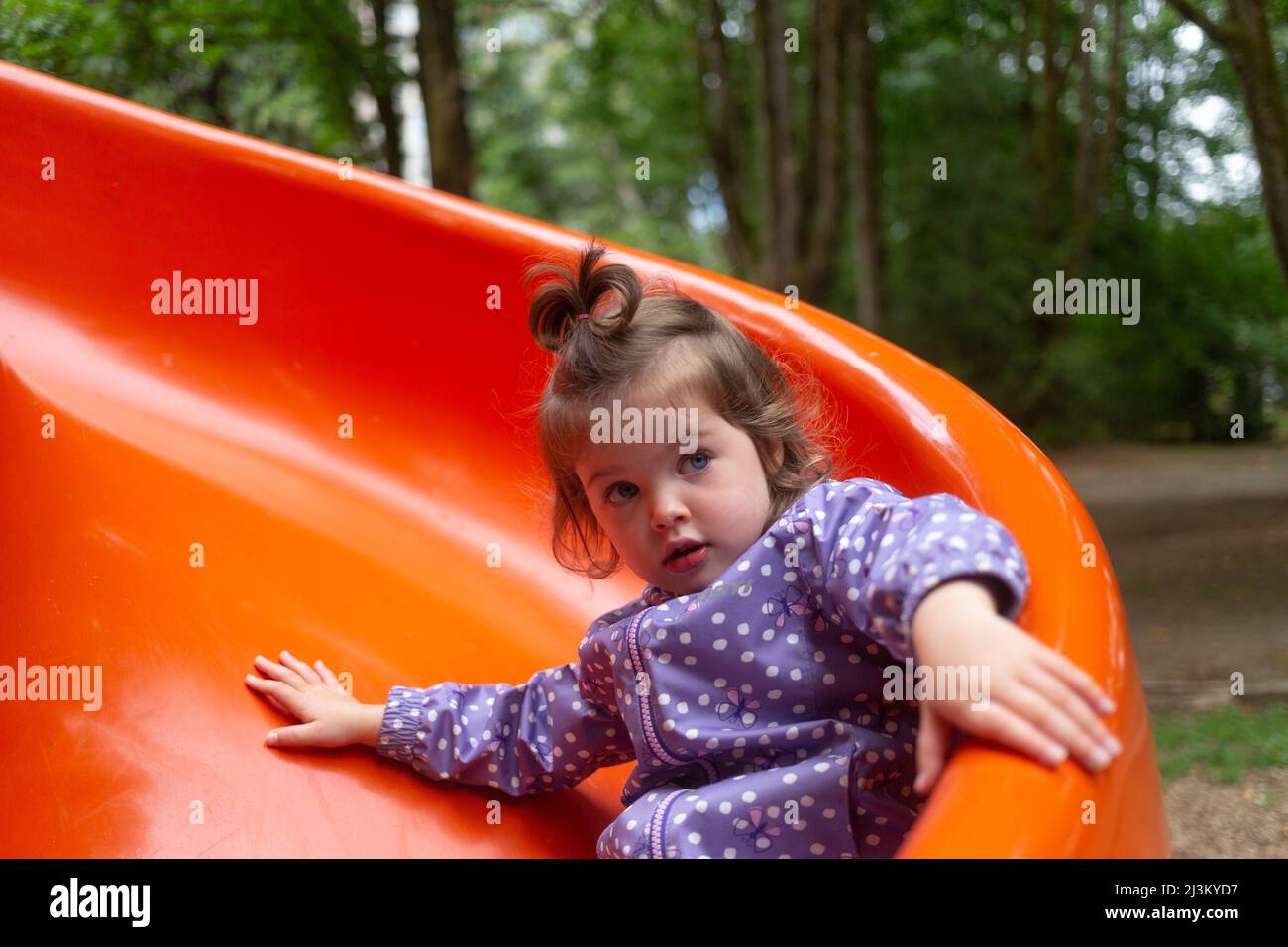 Going down the slide hi-res stock photography and images - Alamy