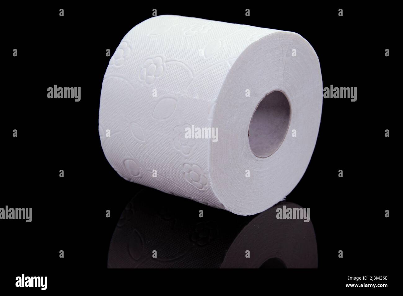 Toilet paper roll on a black background. Presentation of toilet paper ...