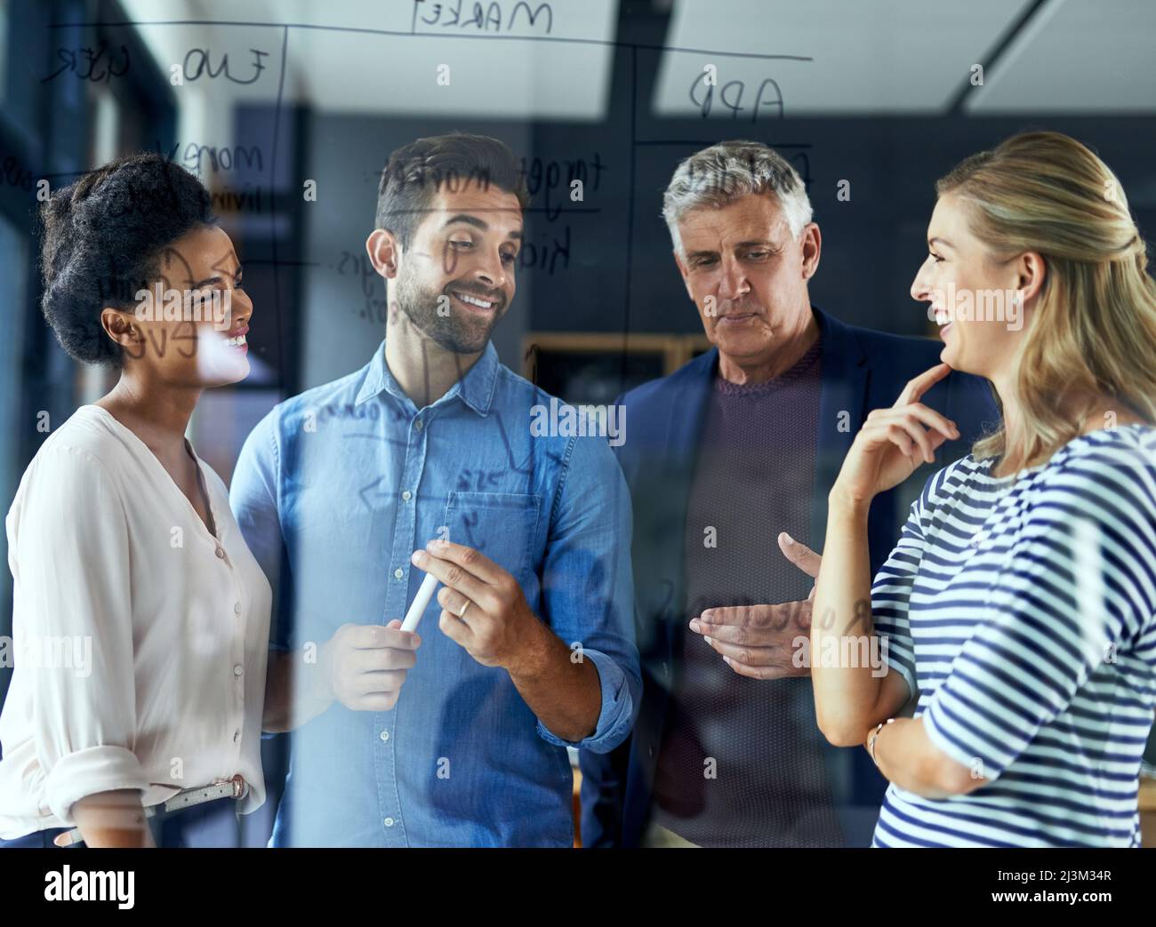 Cooperation is key to a successful collaboration. Shot of a group of ...