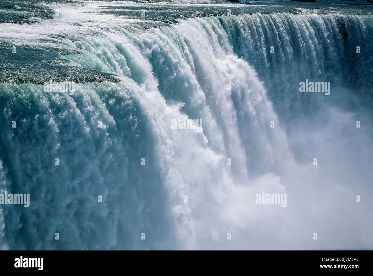 A cascade of water thunders over Niagara Falls.; Niagara Falls, New ...