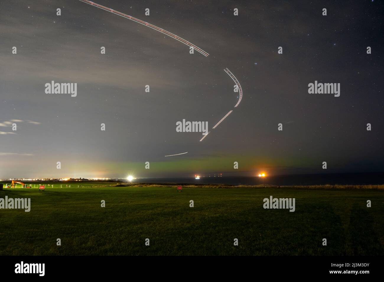 Light trails and faint Aurora in the night sky; South Shields, Tyne and ...