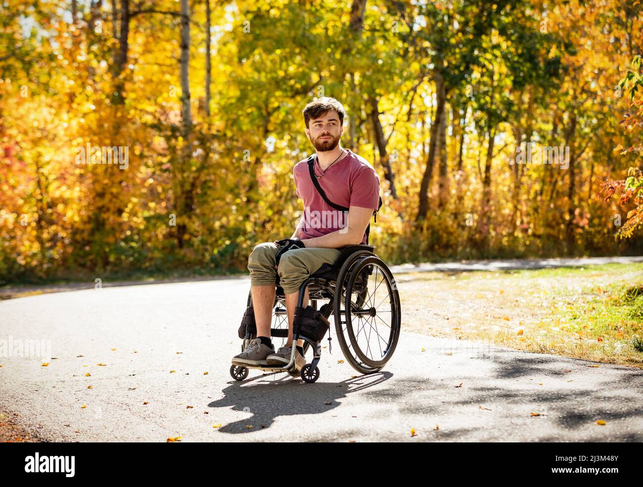 A paralyzed man in a wheelchair hi-res stock photography and images - Alamy