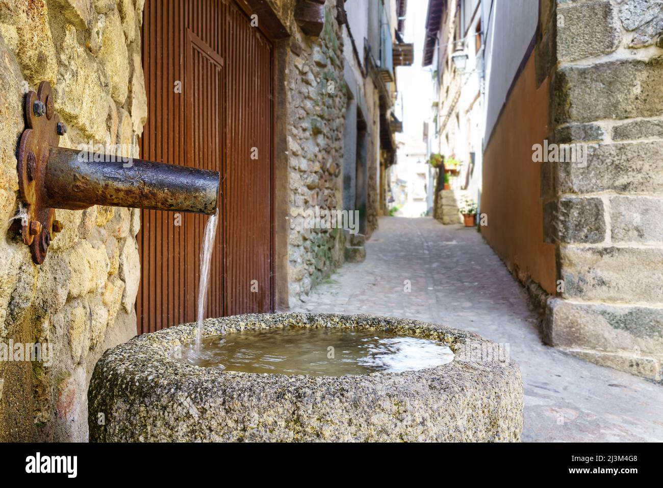 Fresh water fountain in the old medieval village of Salamanca, Spain ...