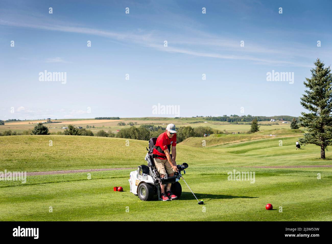 Disabled golfer using a specialized golf assistance motorized hydraulic ...