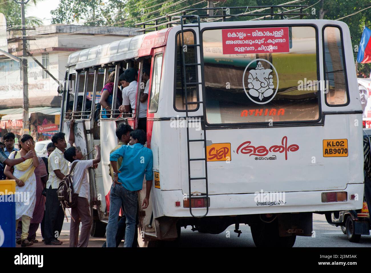 Passengers try to catch local transport bus on road at Chittumala ...