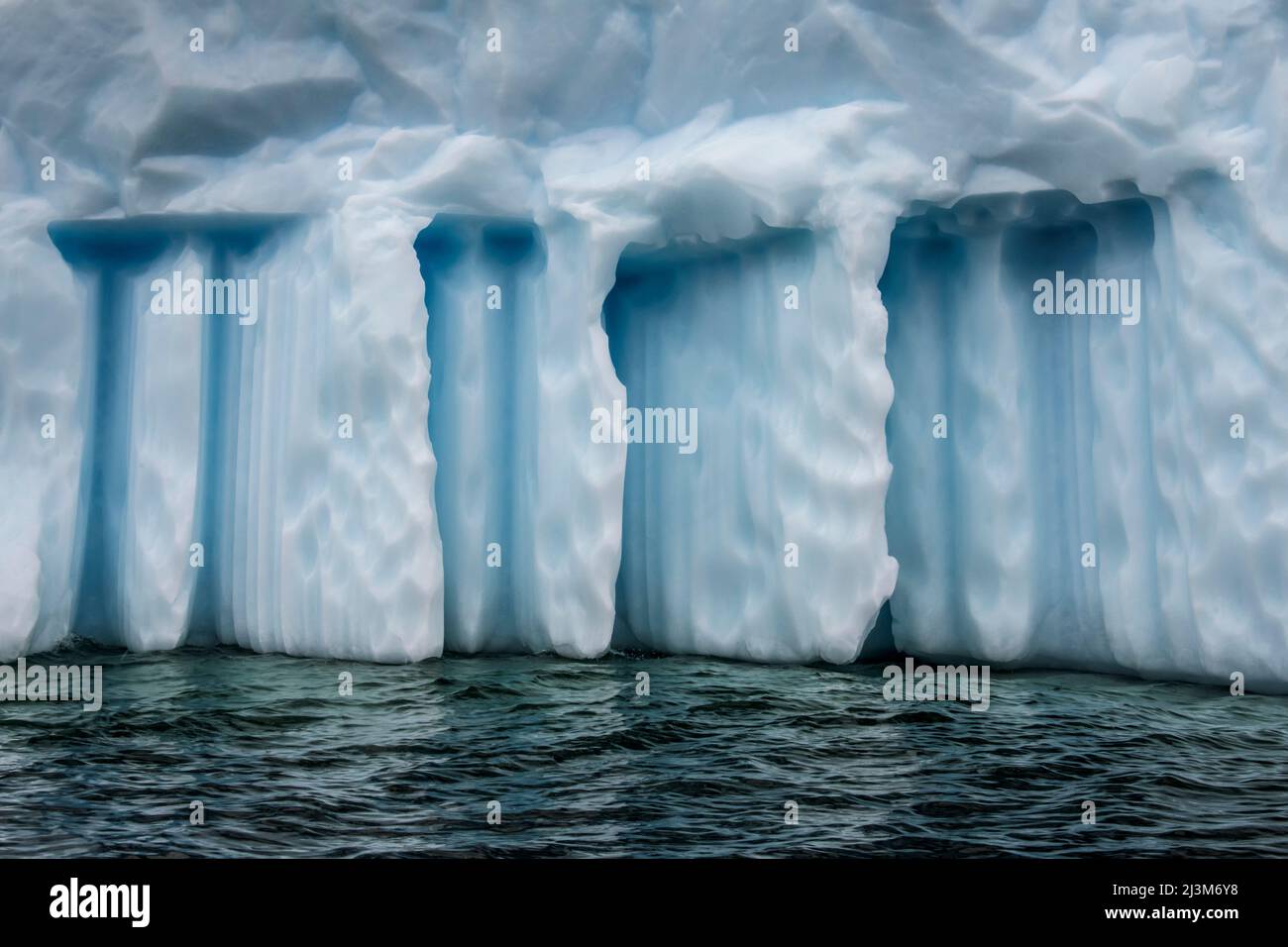 Melted ice channels in an iceberg, Paradise Harbour; Antarctica Stock ...