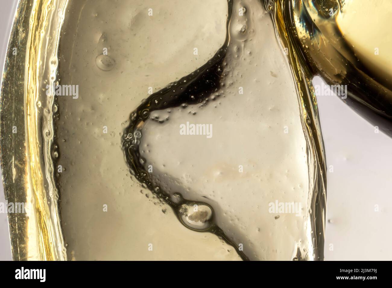Macro still-life showing abstract patterns in Omega-3 oil capsule ...