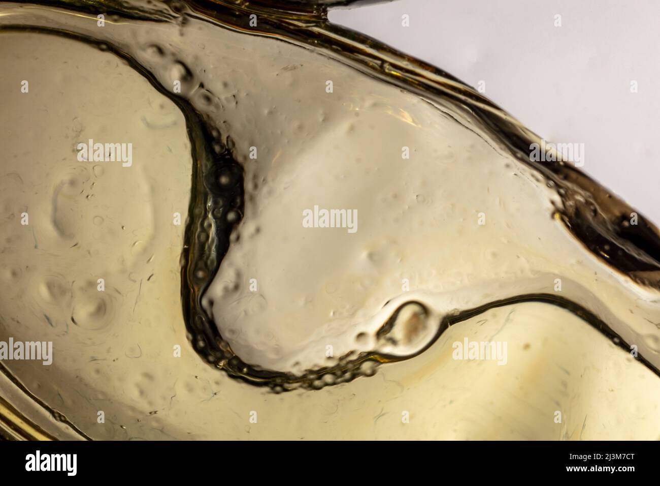 Macro still-life showing abstract patterns in Omega-3 oil capsule ...