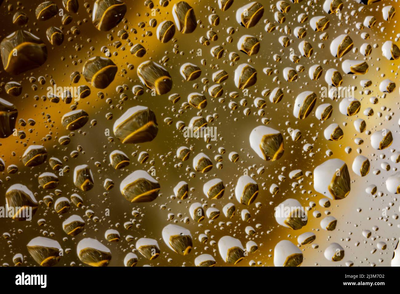 Abstract irregular water drops macro showing reflected colours Stock ...