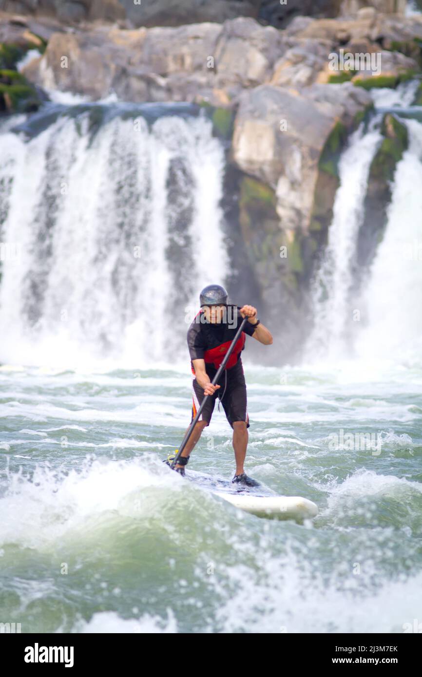 A stand up paddle boarder in white water just below Great Falls.; Great ...