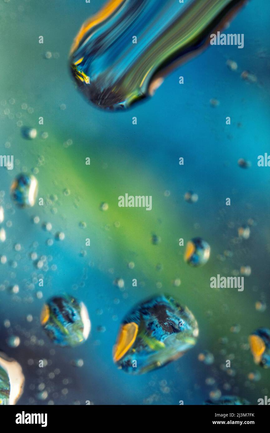 Abstract irregular water drops macro showing reflected colours Stock ...