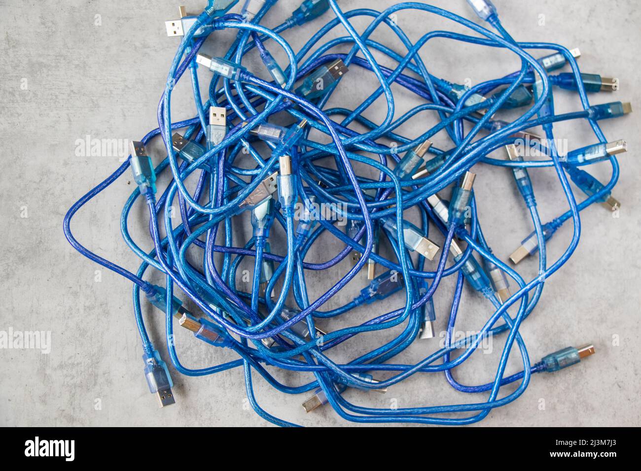 Large group of blue cables, high angle view Stock Photo - Alamy