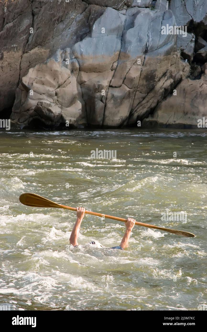 A kayaker in a "squirt" boat goes under water.; Great Falls, Potomac ...