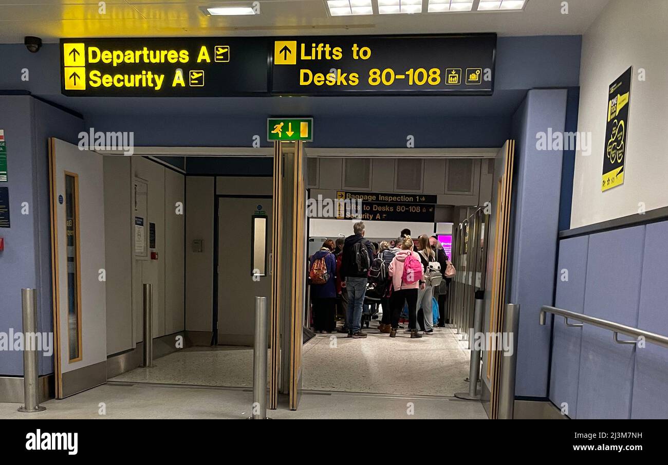 Passengers queue inside the departures area of Terminal 1 at Manchester ...