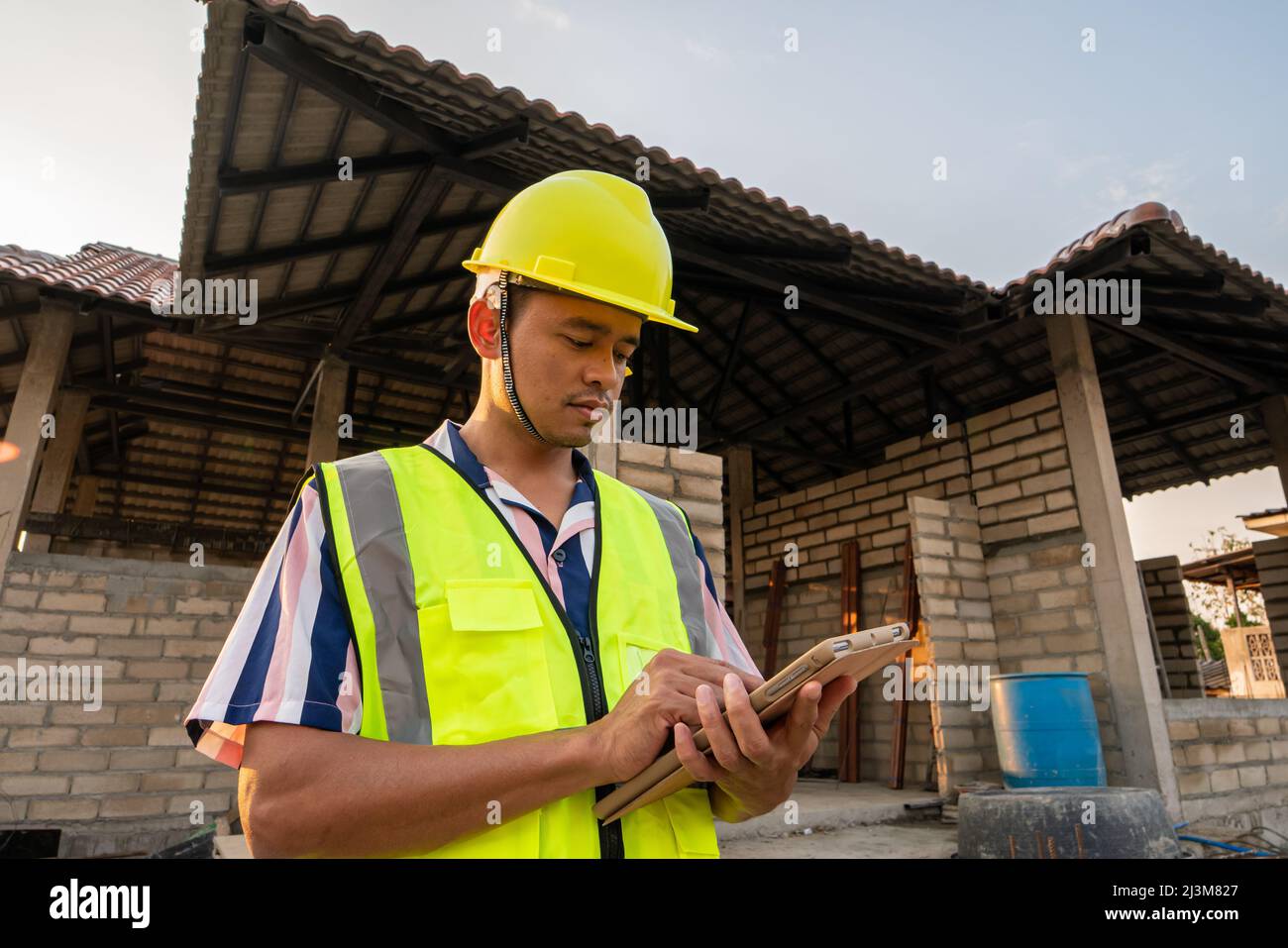 Civil engineering inspecture in construction site building with tablet ...