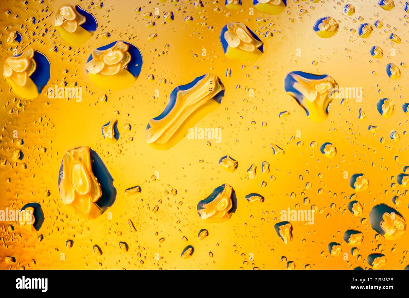 Abstract irregular water drops macro showing reflected colours Stock ...