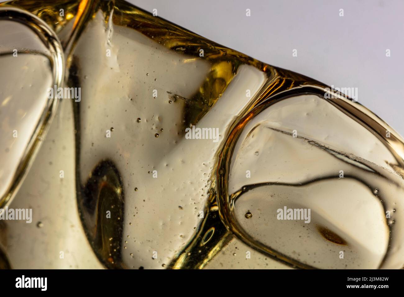 Macro still-life showing abstract patterns in Omega-3 oil capsule ...