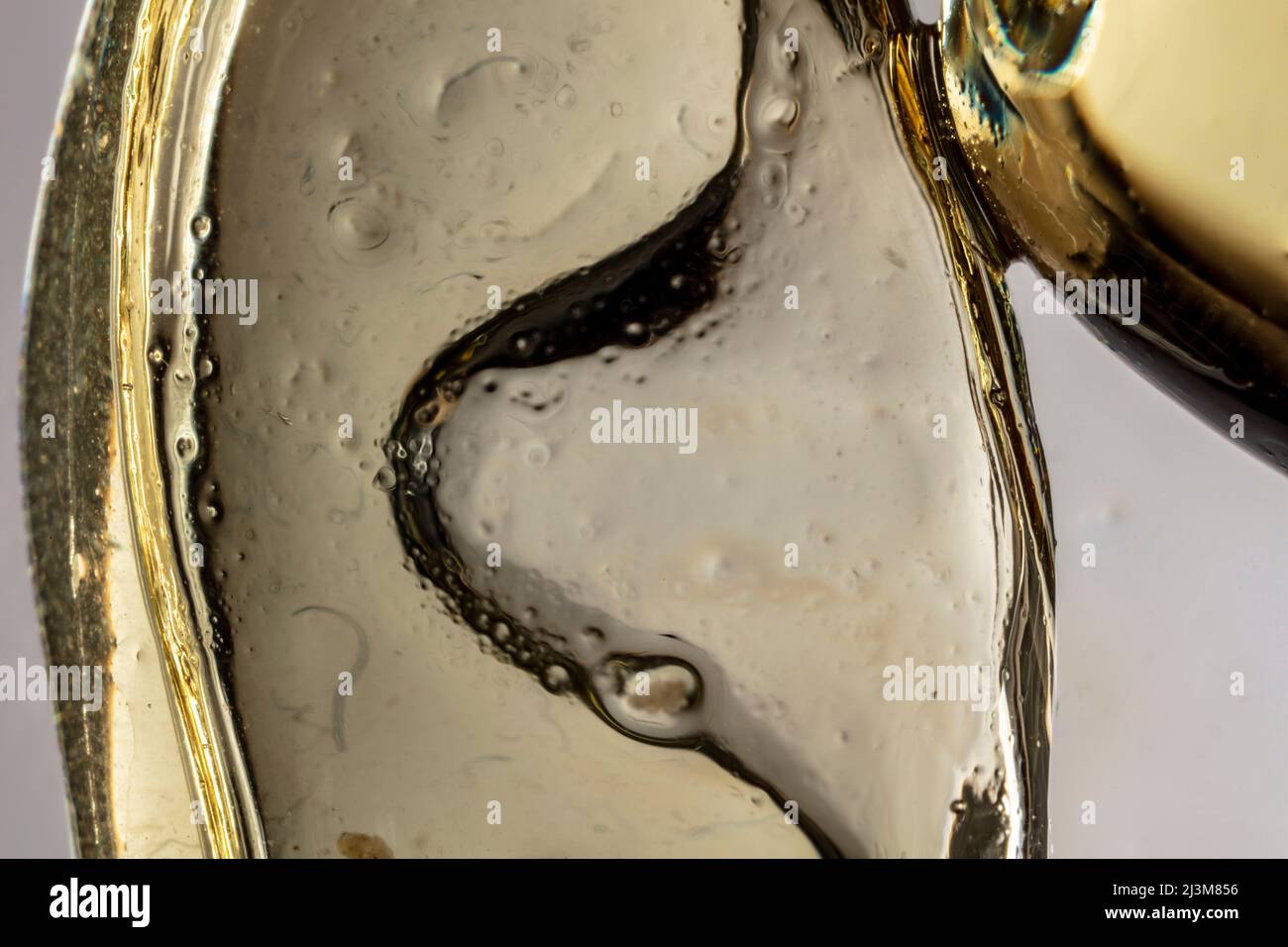 Macro still-life showing abstract patterns in Omega-3 oil capsule ...