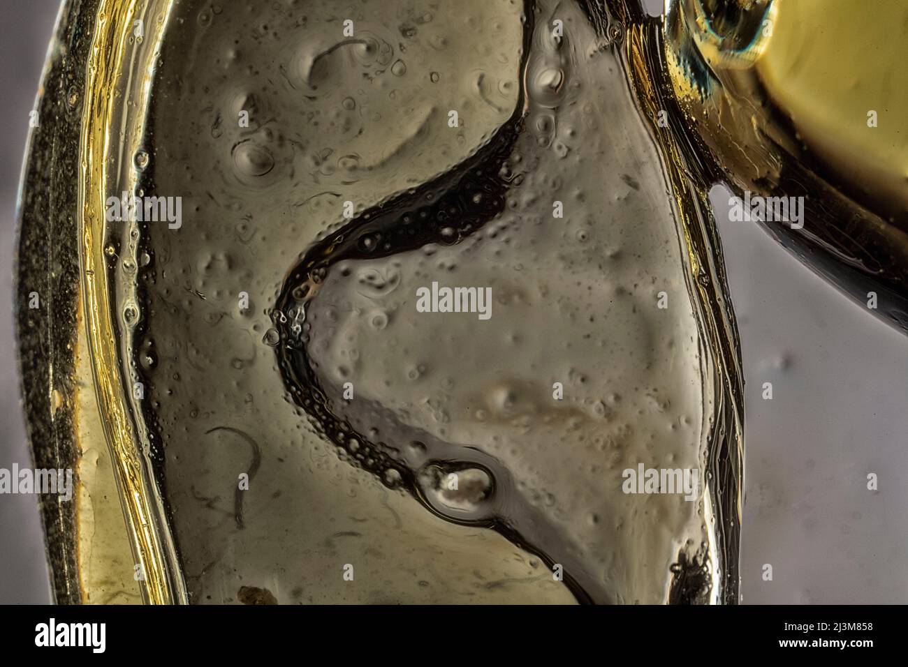 Macro still-life showing abstract patterns in Omega-3 oil capsule ...