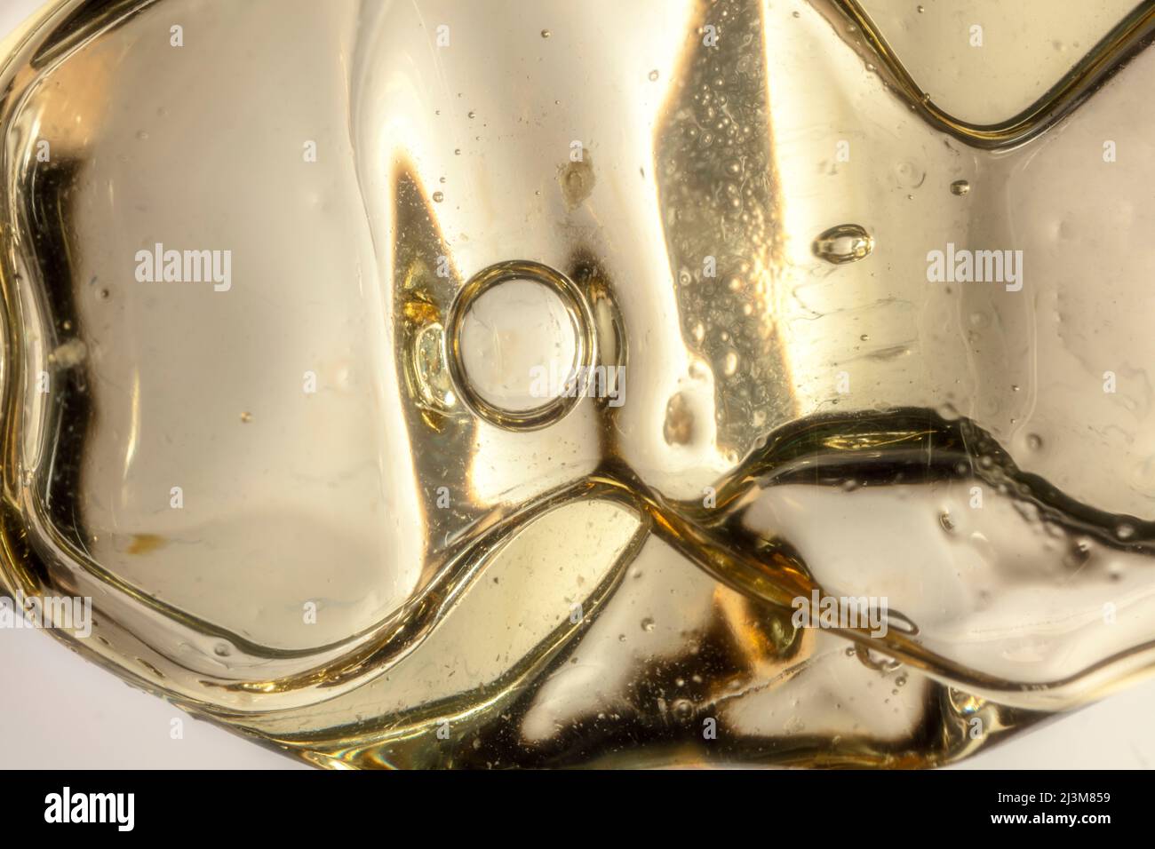 Macro still-life showing abstract patterns in Omega-3 oil capsule ...