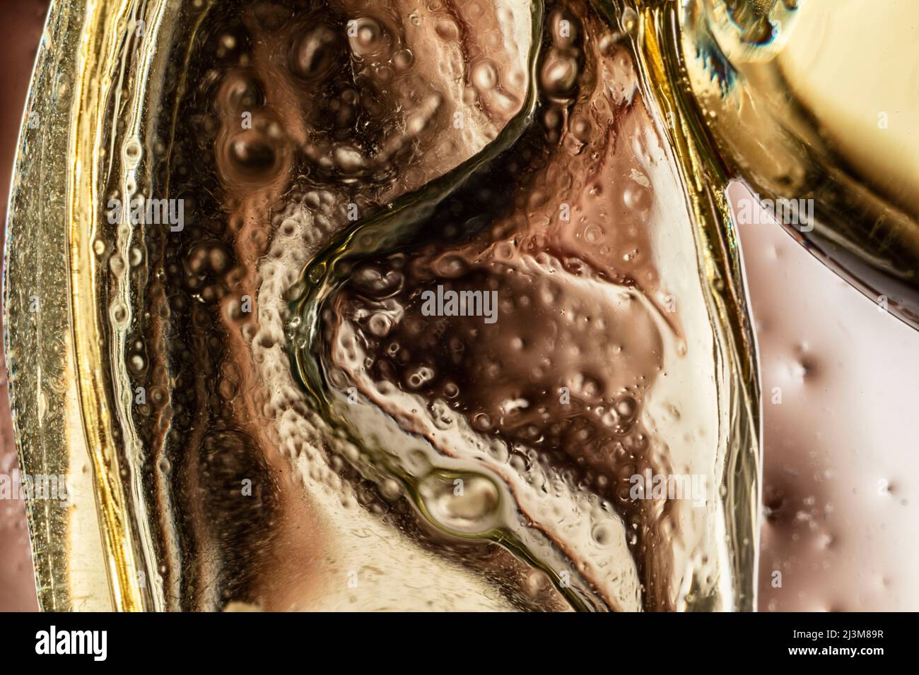 Macro still-life showing abstract patterns in Omega-3 oil capsule ...