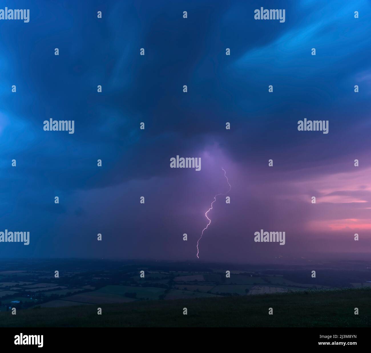 A bolt of lightning from a high based thunderstorm strikes the ...