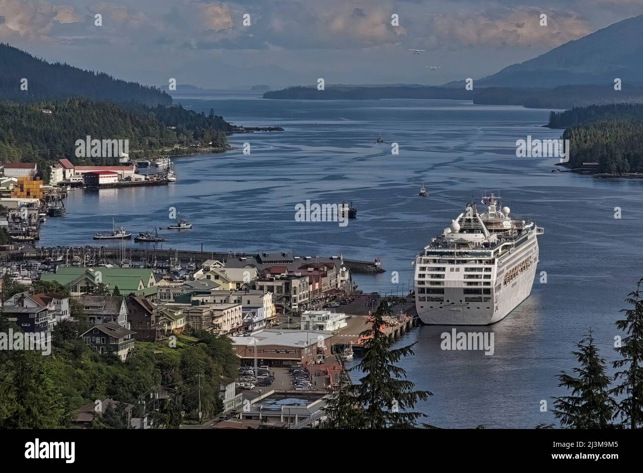 A cruise ship docks at Ketchikan's harbor bringing a city full of ...