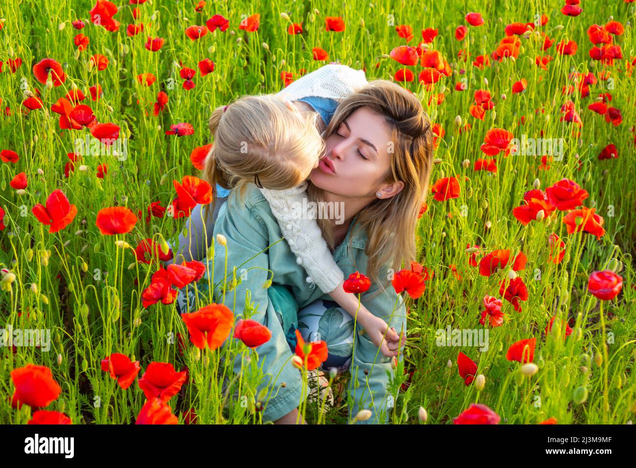 Child hugs mother in nature hi-res stock photography and images - Alamy