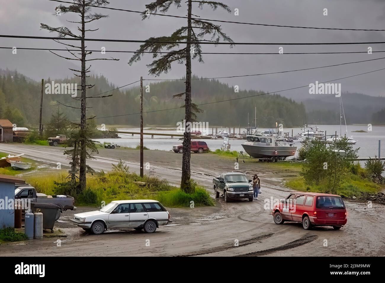 A few cars make a traffic jam on a rainy afternoon at the main ...