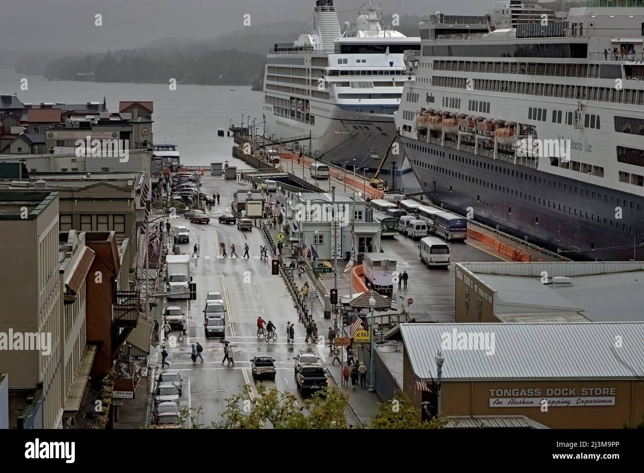 Cruise ships dock at Ketchikan's harbor, while another waits its' turn ...