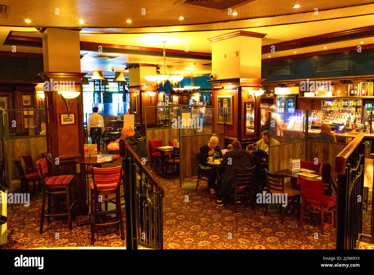 Traditional interior view of Wetherspoon The Eight Bells pub at Cannon ...