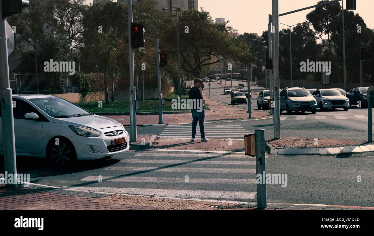 person crossing a crosswalk Stock Photo - Alamy
