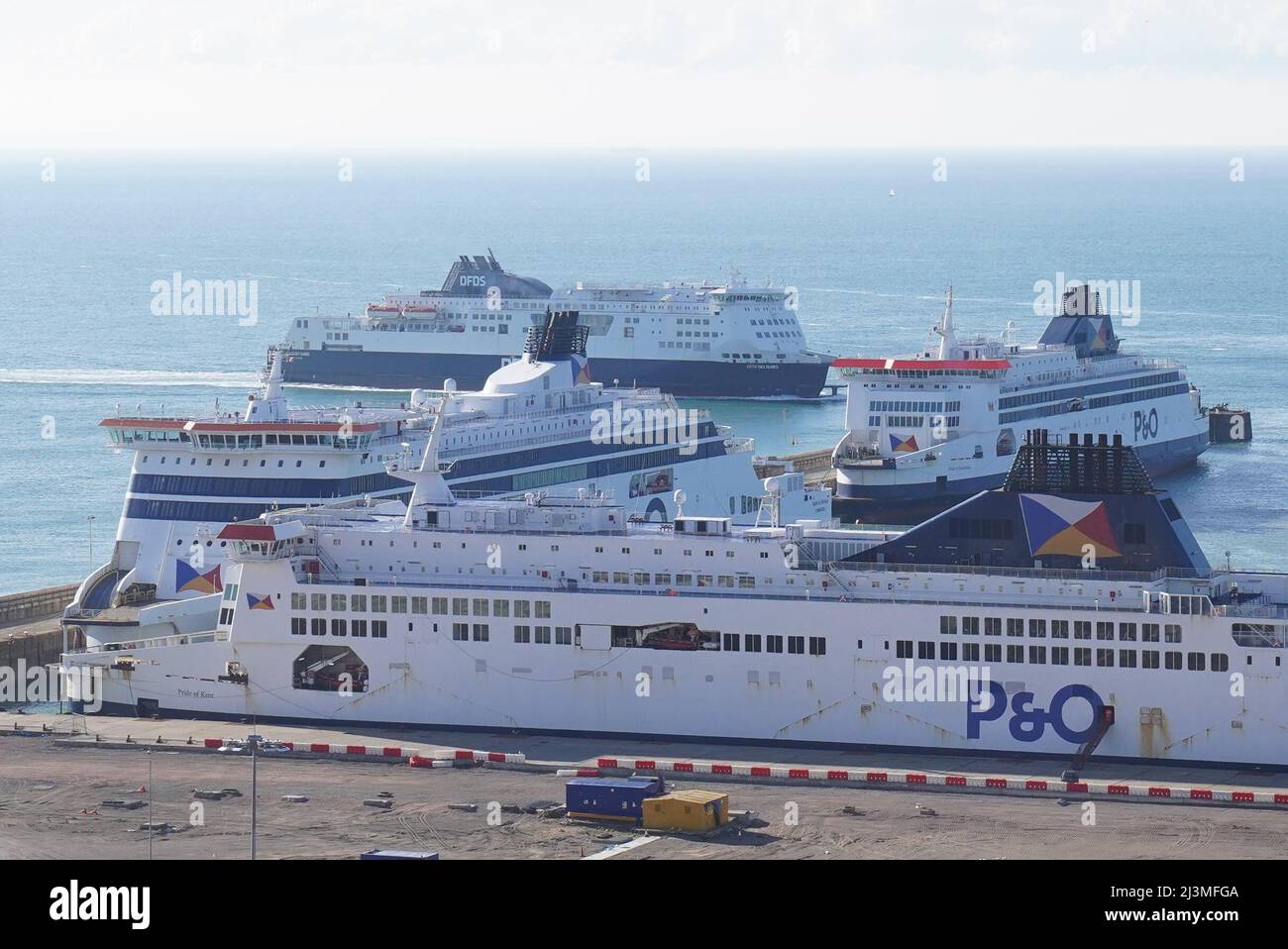 A DFDS ferry (top left) arrives at the Port of Dover in Kent passing ...