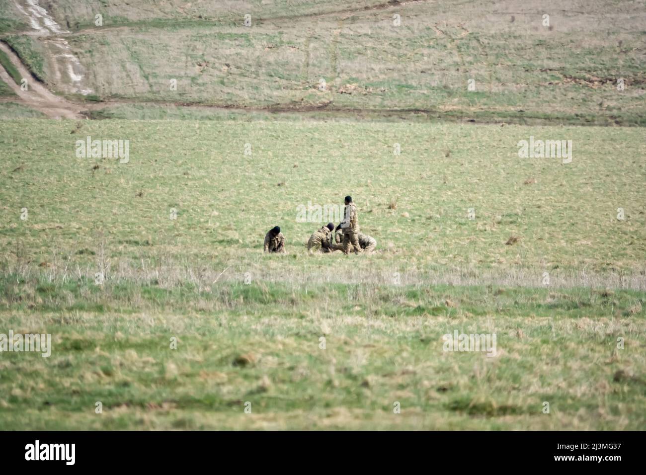 British army soldiers preparing in-ground explosives for a mock battle ...