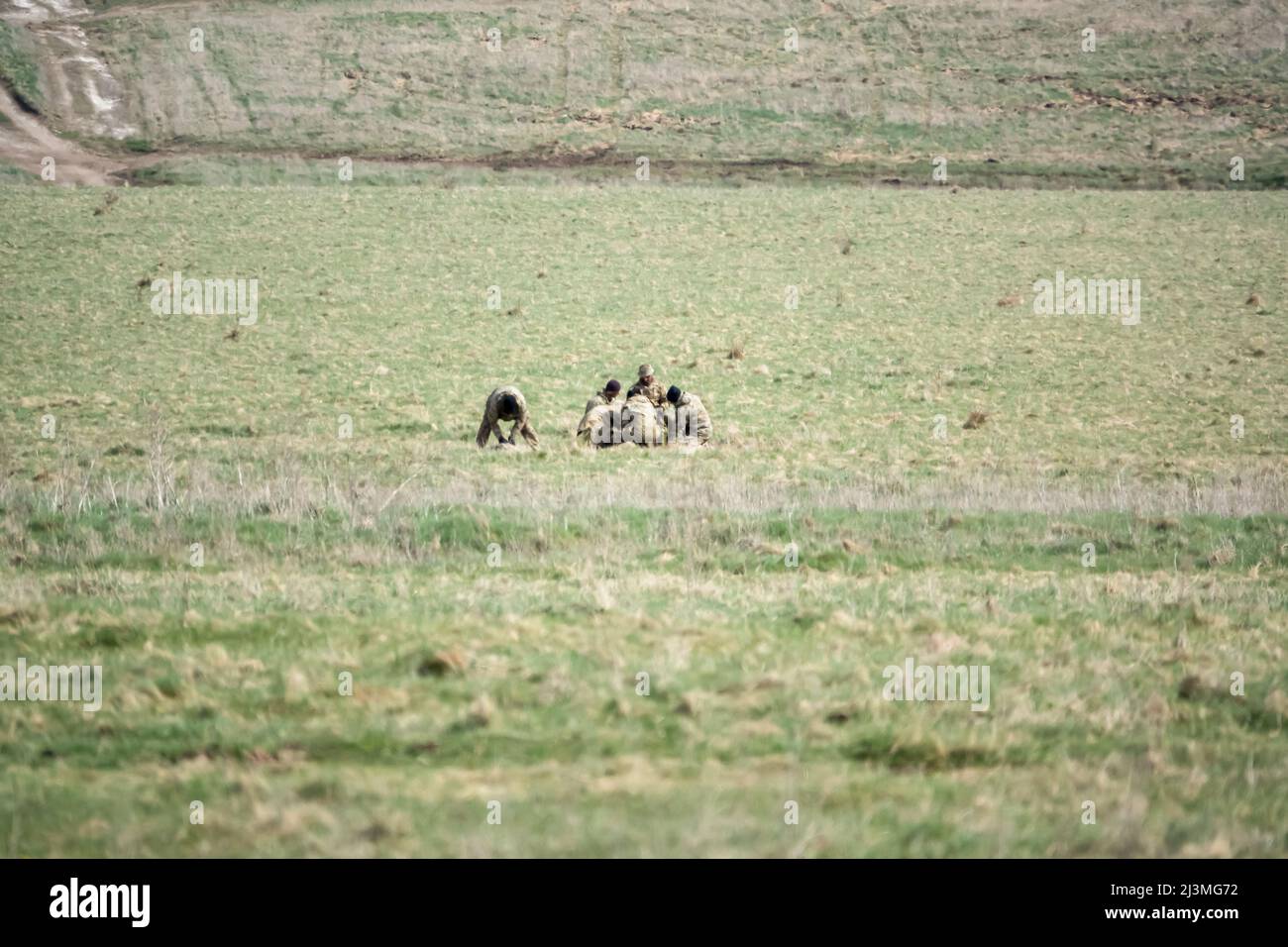 British army soldiers preparing in-ground explosives for a mock battle ...